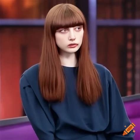 Mia Goth Getting Her Bangs Trimmed On A Talk Show On Craiyon