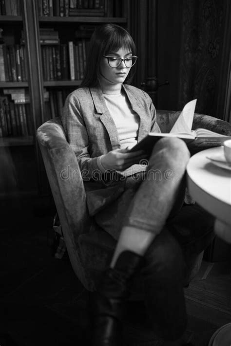 Beautiful Dreamy Girl In Stylish Sharp Glasses In The Library Stock