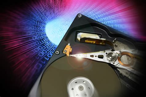 close up of open hard disk drive over future binary code background