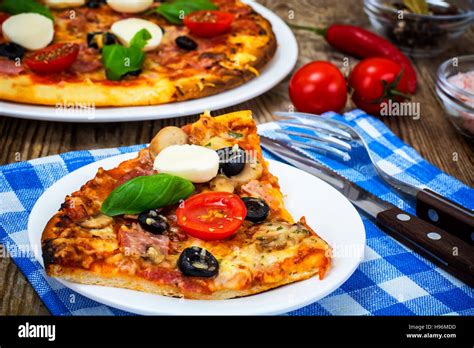 Italian Pizza With Ham Cheese Mushrooms Tomatoes And Mozzarella