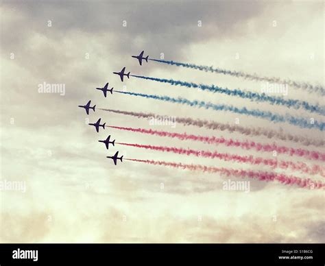 Red Arrows Flying Through Sky Stock Photo Alamy