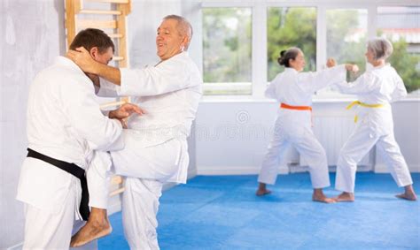Old Man Attendee Of Karate Classes Fighting With His Opponent In Sports