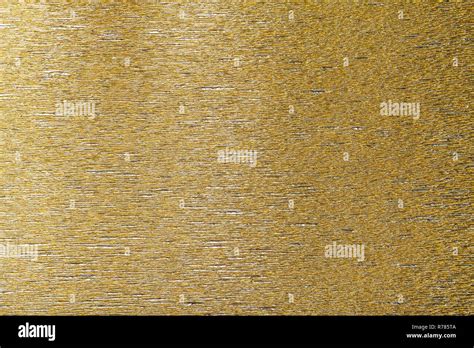 Textural Of Golden Foil Background Of Wavy Corrugated Paper Closeup