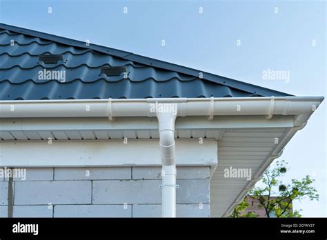 New Metal Tile Roof With White Rain Gutter Sip Panel House