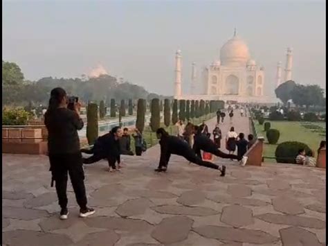 Group Of Girls Did Surya Namaskar At The Gate Of Taj Mahal