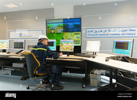 Energy Flow Monitored By An Engineer In Control Room Station Stock