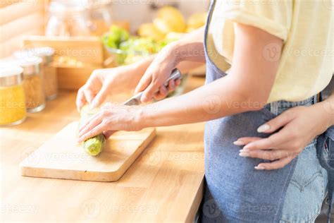 Lesbian Couple Standing In Kitchen Lesbian Couple Standing In A Modern