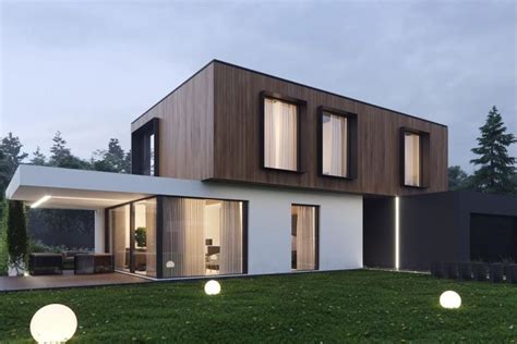 A Modern House Is Lit Up At Night In The Grass With Lights On It S Side