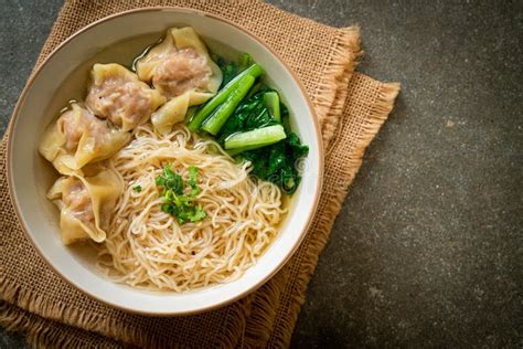 Egg Noodles With Pork Wonton Soup Or Pork Dumplings Soup And Vegetable