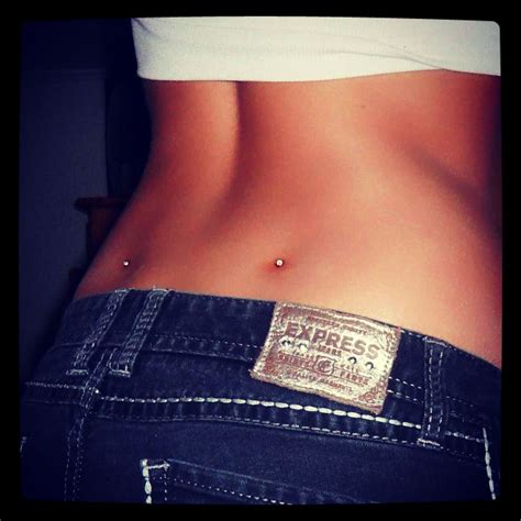 Back Dimples Piercing With Tattoo