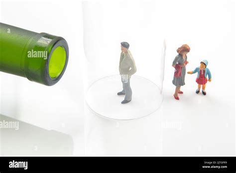 Miniature People Man Addicted To Alcohol On The Background Of A Bottle