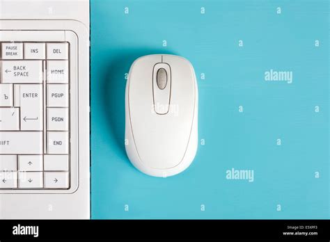 White Mouse And Laptop Keyboard On Table Top View Stock Photo Alamy