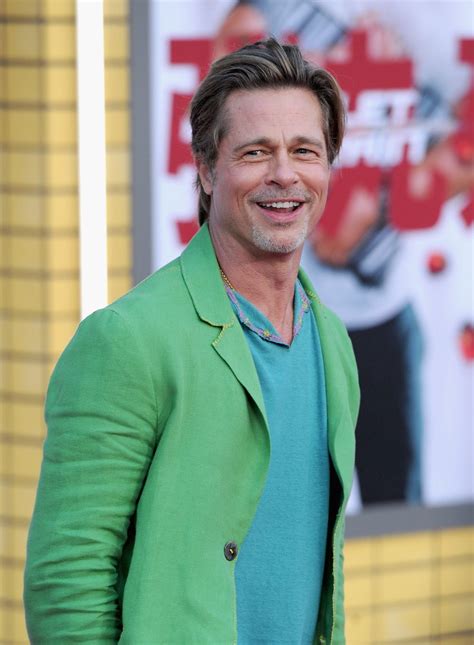 Margot Robbie Addresses Backlash Over Unscripted Brad Pitt Kiss