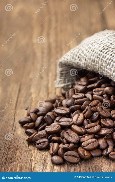 Coffee Beans In Burlap Bag On Wooden Table Stock Image Image Of Natural Energy