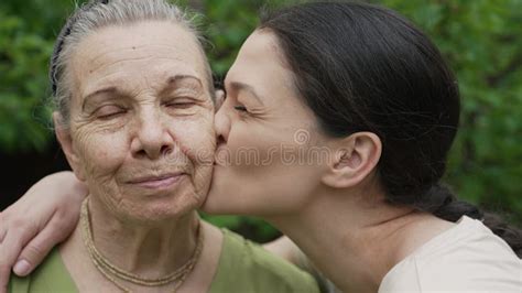 Granddaughter Kissing Grandmother On The Cheek Stock Video Video Of