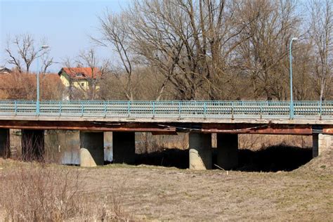 Aging Concrete Bridge With Visible Structural Deterioration Stock Image