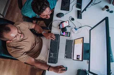 programmers engrossed in deep collaboration diligently working