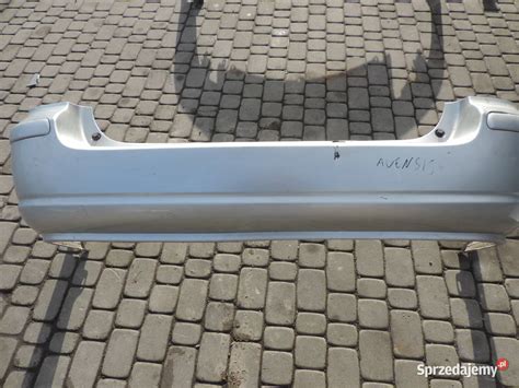 ZDERZAK TYŁ TYLNY TOYOTA AVENSIS T25 KOMBI KOLOR 1C0 Nowy Sącz