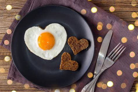 Valentines Day Breakfast With Heart Shaped Fried Eggs Served On Grey