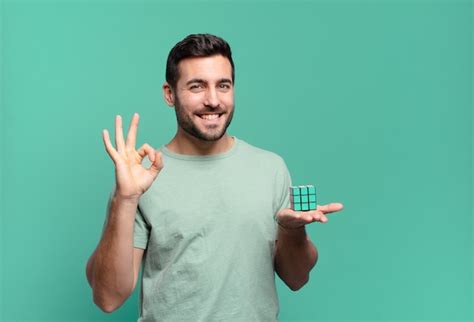 Premium Photo Young Handsome Man Solving An Intelligence Problem