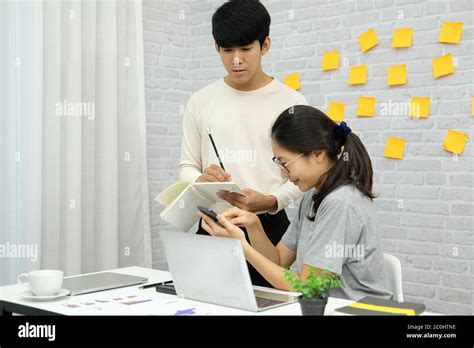 Man Woman Colleagues Analyzing Data On Computer Startup Teamwork Coworking Team Working At Home