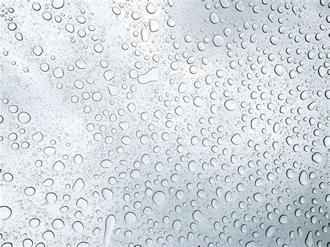 A Close Up Of Water Droplets On A Window Photo Rain Drops Image On