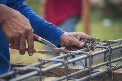 Men Hands Using Pincer Pliers Iron Wire Reinforcement Of Concrete Work