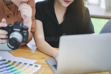 Graphic Designer Working On Computor And Graphics Tablet In Her Working