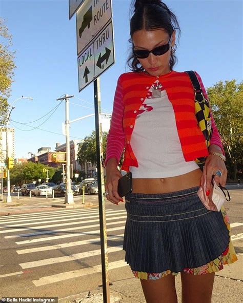 Bella Hadid Shows Off Her Midriff In Low Rise Pleated Skirt And Tee