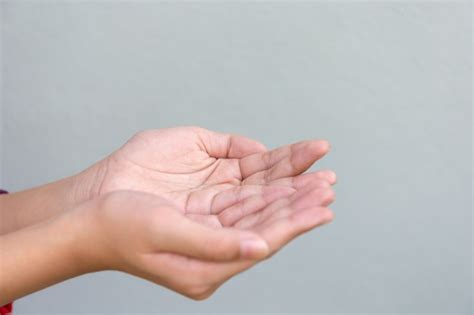 Premium Photo Hands On A Gray Background