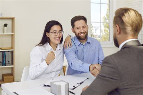 Husband And Wife Receive Congratulations From Bank Employee On Renting