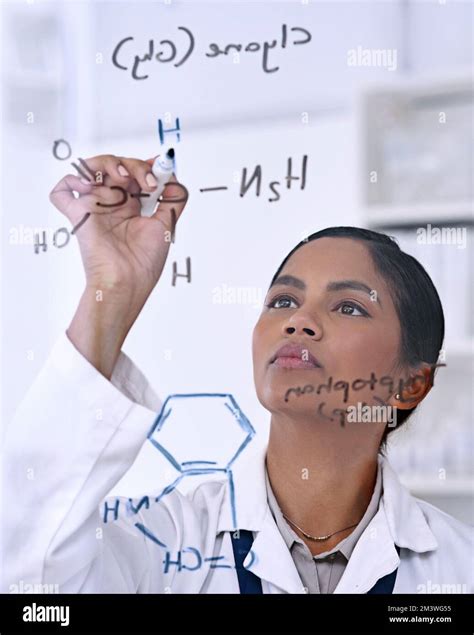 Creating A New Formula An Attractive Young Female Scientist Working On