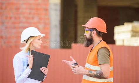 Discuss Progress Plan Woman Engineer And Bearded Brutal Builder Discuss Construction Progress