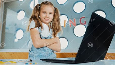 Smart Cute Girl Using Laptop Programing Software While Crossing Arms Erudition Stock Image