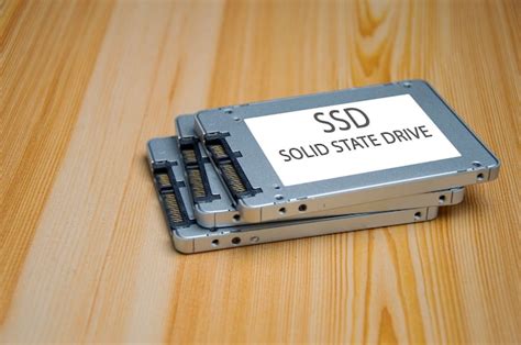 Premium Photo Ssd Disk Drive Placed On Wooden Surface High Speed Ssd