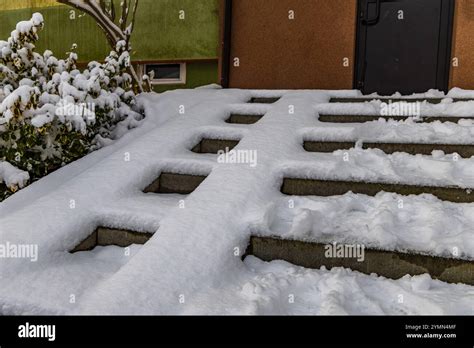 First Snowfall Snow Covered Stairs And Wheelchair Ramp Leading To The