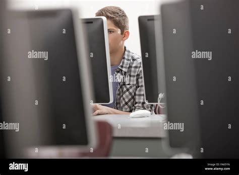 A School Room Computer Laboratory Or Lab With Rows Of Computer Monitors And Seating Young