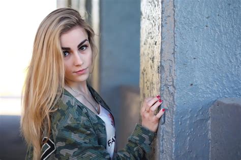Premium Photo Portrait Of Young Woman On Wall Background Trendy Urban