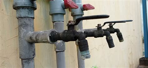 Three Faucets Neatly Arranged For Different Functions Stock Image