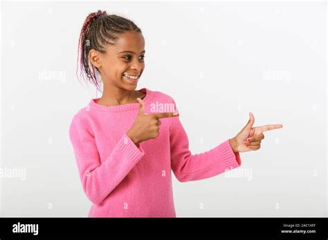 Image Of Cheerful African American Girl Smiling And Pointing Fingers