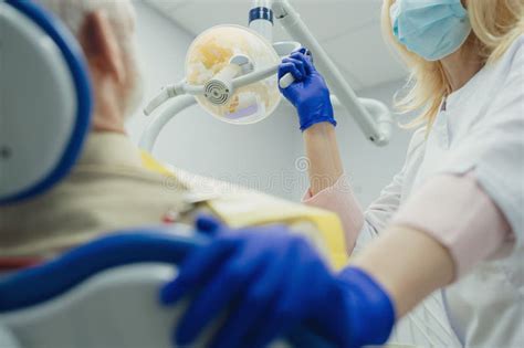 Dental Doctor Treating A Male Patient In Hospital Stock Image Image