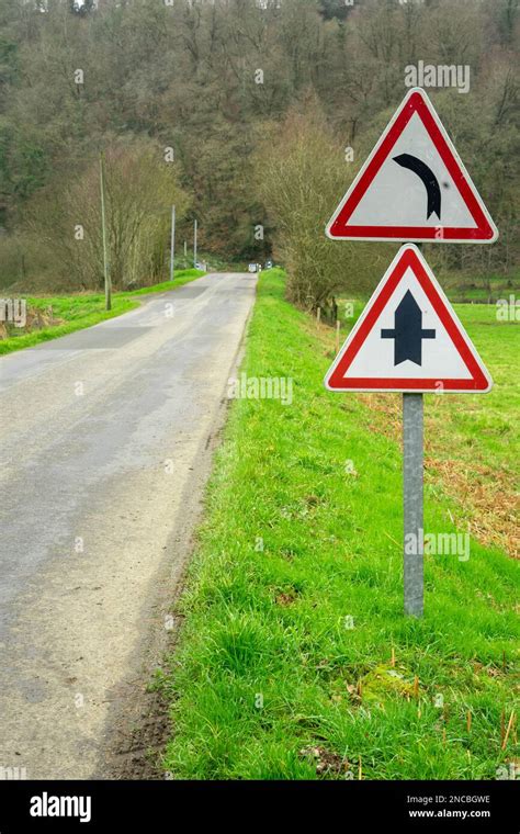 Road And Road Sign Warning About A Turn In The Road Road Safety