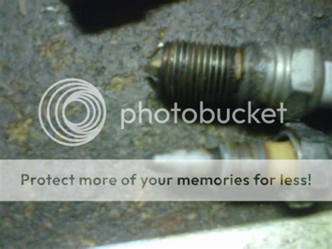 Spark Plug Threads Stuck In Hole