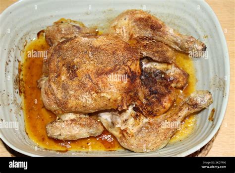 Top Down View Up Whole Roast Chicken In Light Blue Ceramic Dish Home