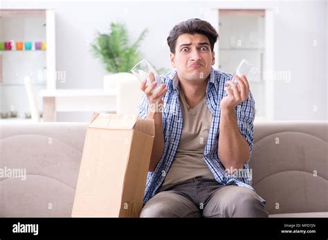 Man Receiving Wrong Parcel With Glasses Stock Photo Alamy