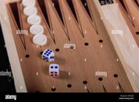 Board To Play Backgammon With Pieces And Dice Board Game Pastime Fun On Black Background