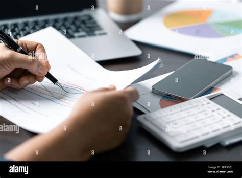 Business Data Analysis On Laptop Financial Charts Graphs Reports For