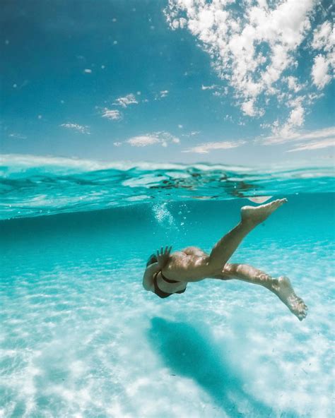 Download A Woman Is Swimming In The Ocean