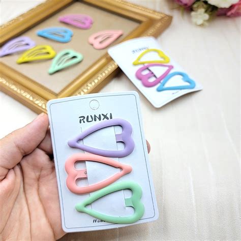 قیمت و خرید گیر مو دخترانه مدل تق تقی شمعی قلبی بسته سه عددی