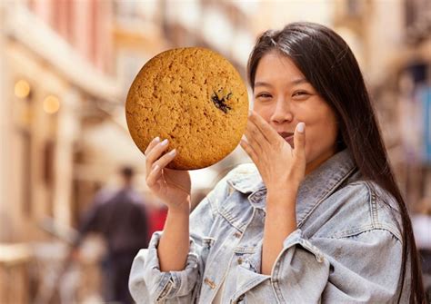 Premium Photo Medium Shot Woman With Giant Cookie